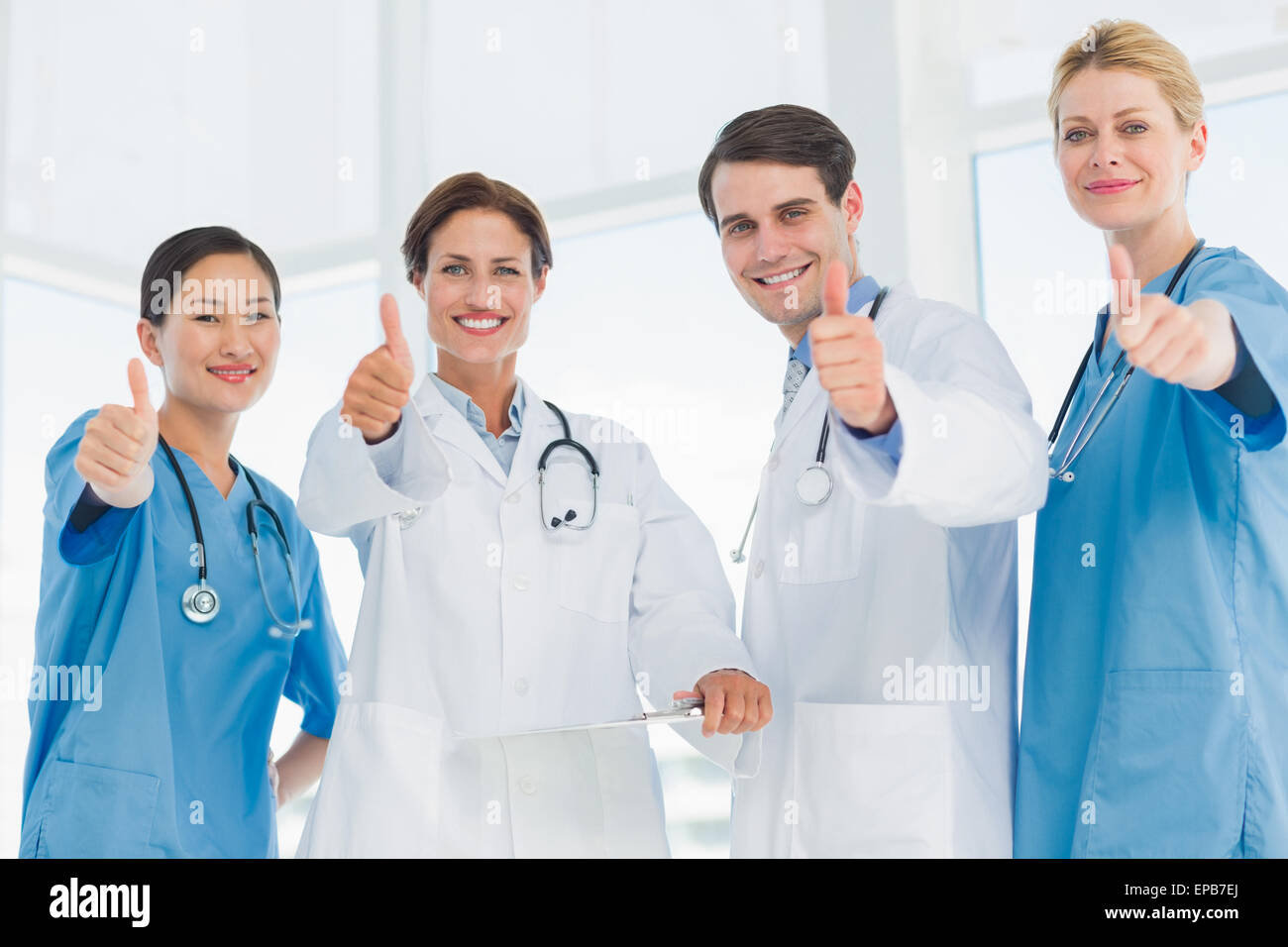 Group hospital staff thumbs up hi-res stock photography and images - Alamy