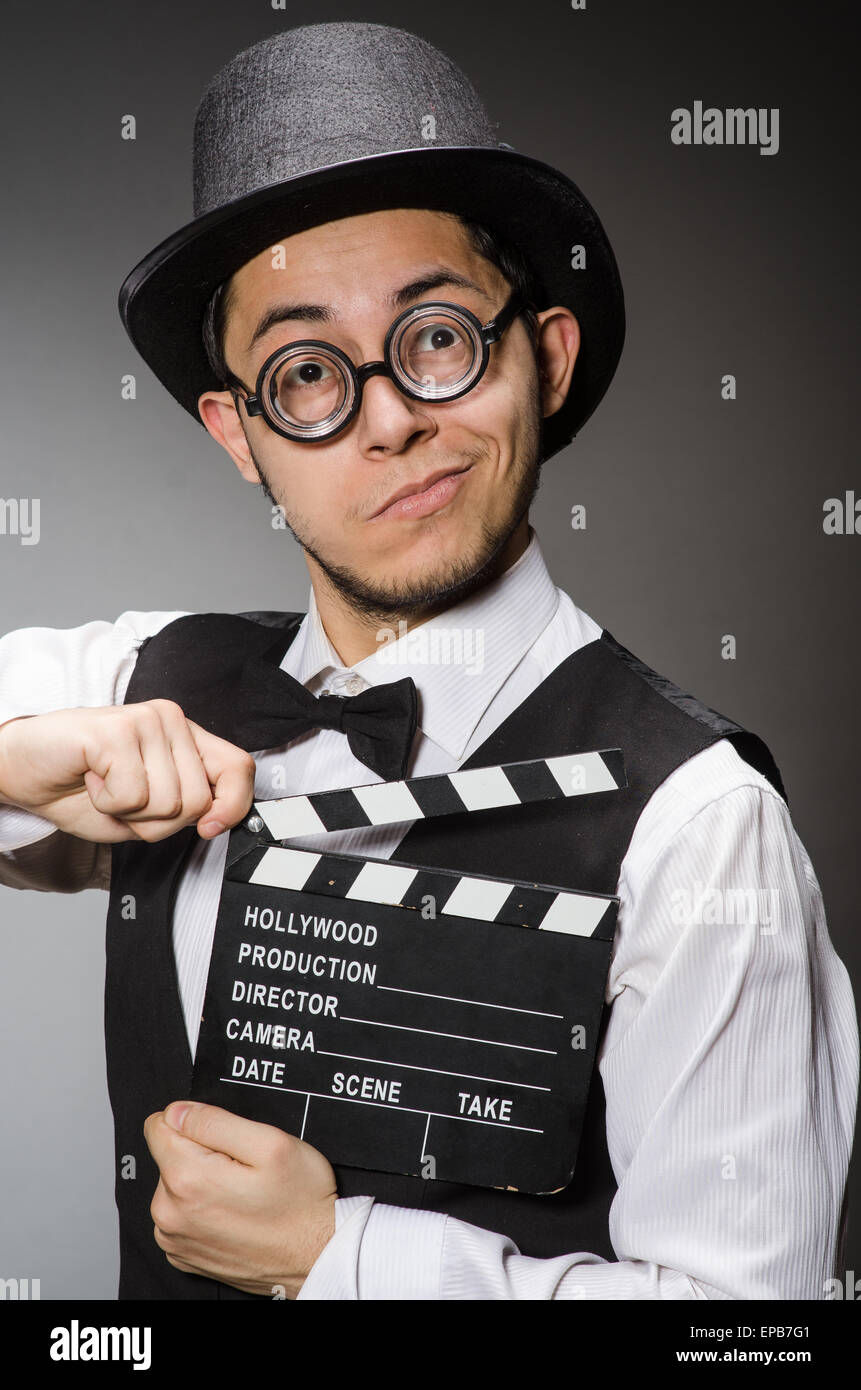 Funny man with movie clapper Stock Photo - Alamy