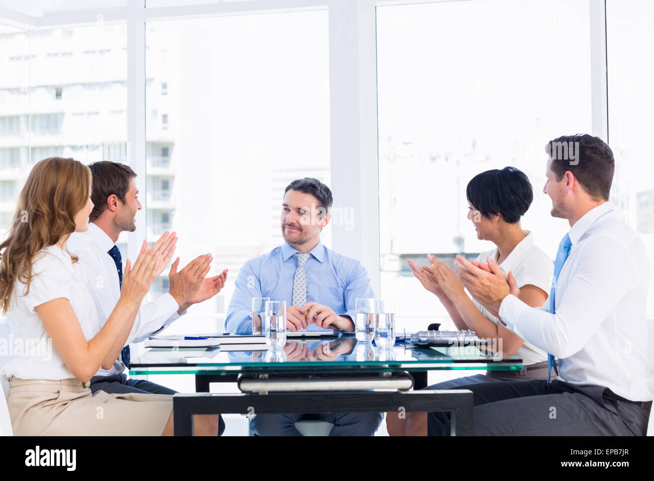 Executives sitting around conference table hi-res stock photography and ...