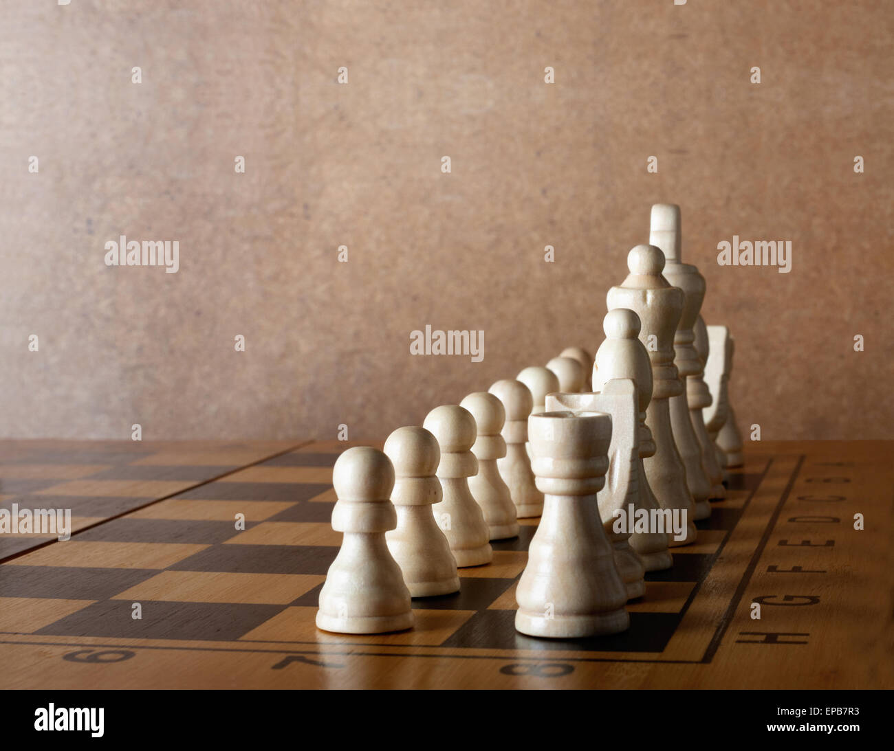Wooden chess board with figures on green table and old wall Stock Photo ...