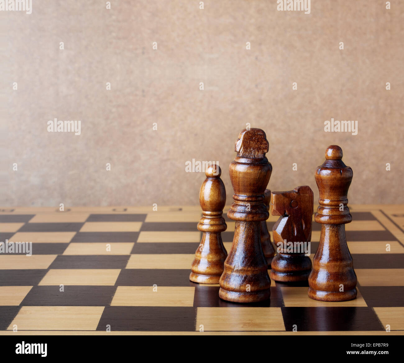 Wooden chess board with figures on table and old wall Stock Photo - Alamy