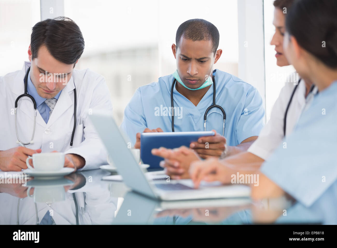 Group young doctors working together hi-res stock photography and ...