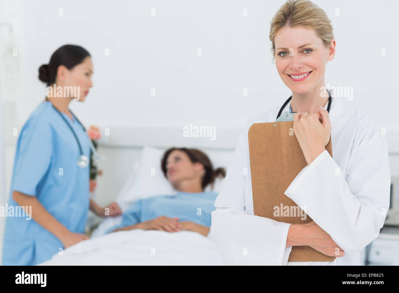 Smiling doctor with patient in hospital Stock Photo - Alamy
