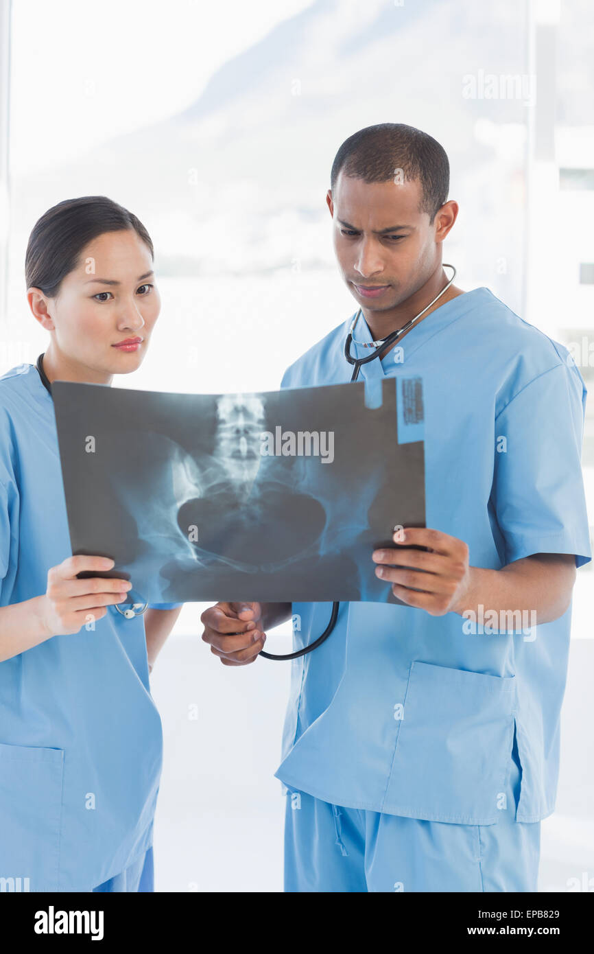 Two surgeons examining x-ray Stock Photo - Alamy