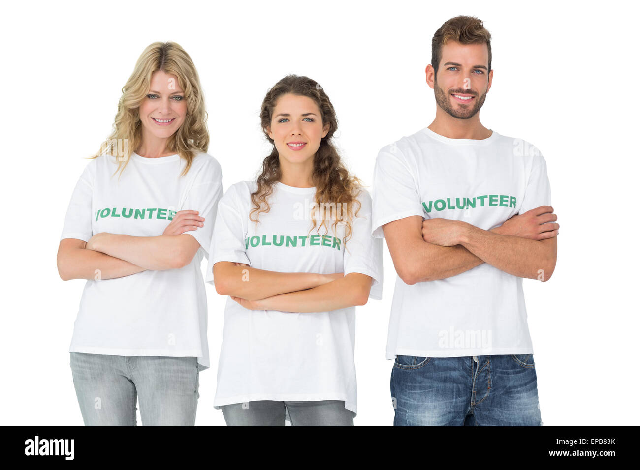 Portrait of three happy volunteers standing with hands crossed Stock ...