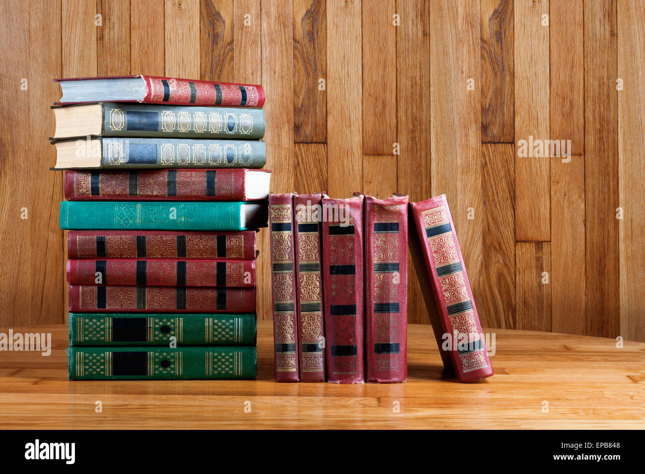 Richly decorated volumes of books with a gold lettering on the ...