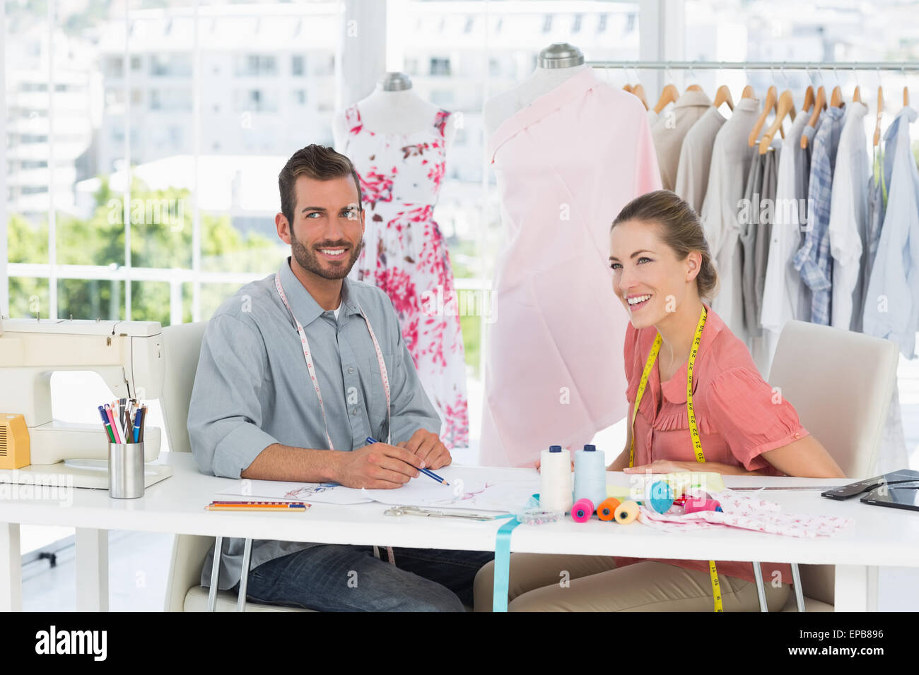 Fashion designers at work in bright studio Stock Photo - Alamy