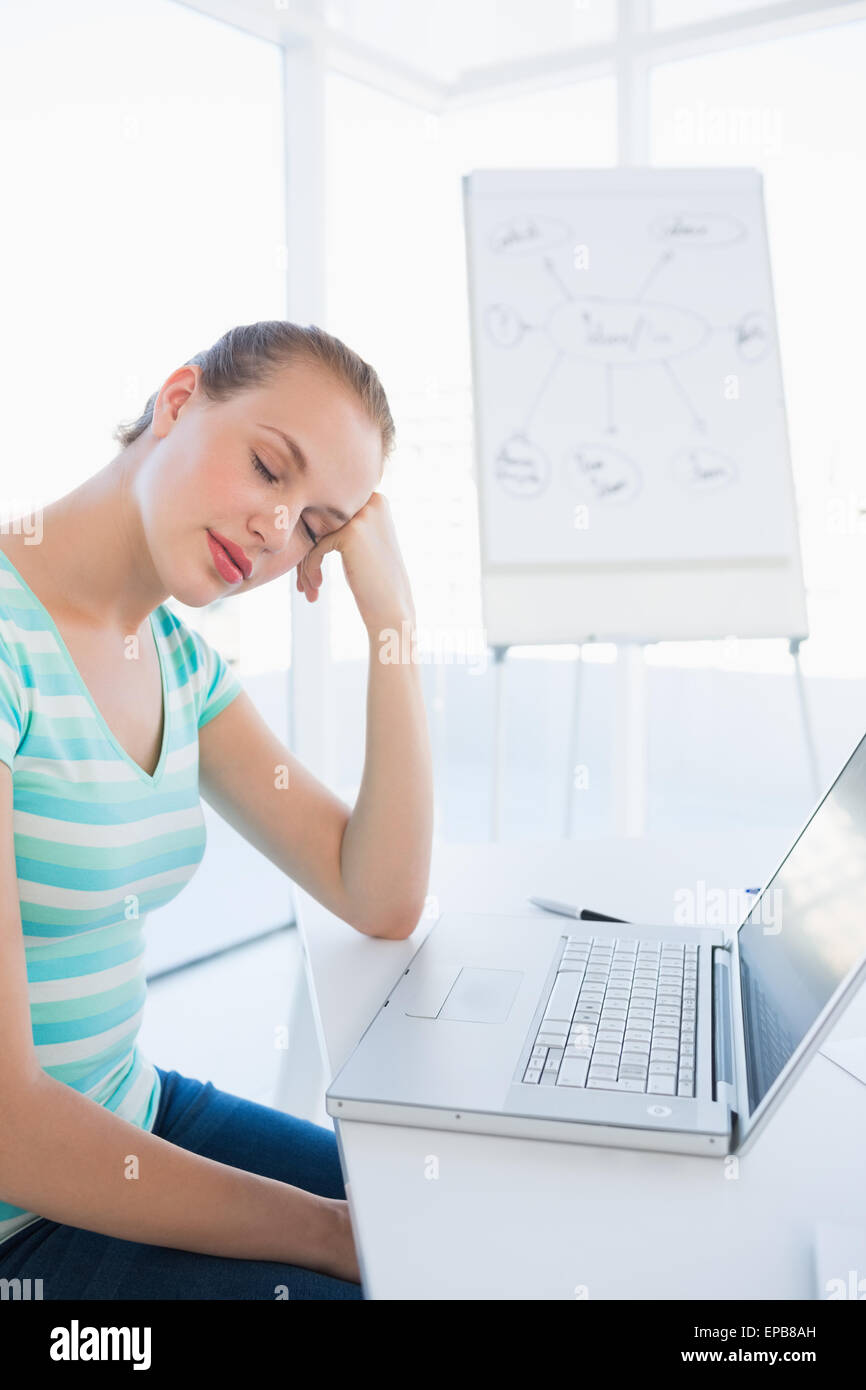 Casual woman sleeping in front of laptop at office Stock Photo - Alamy