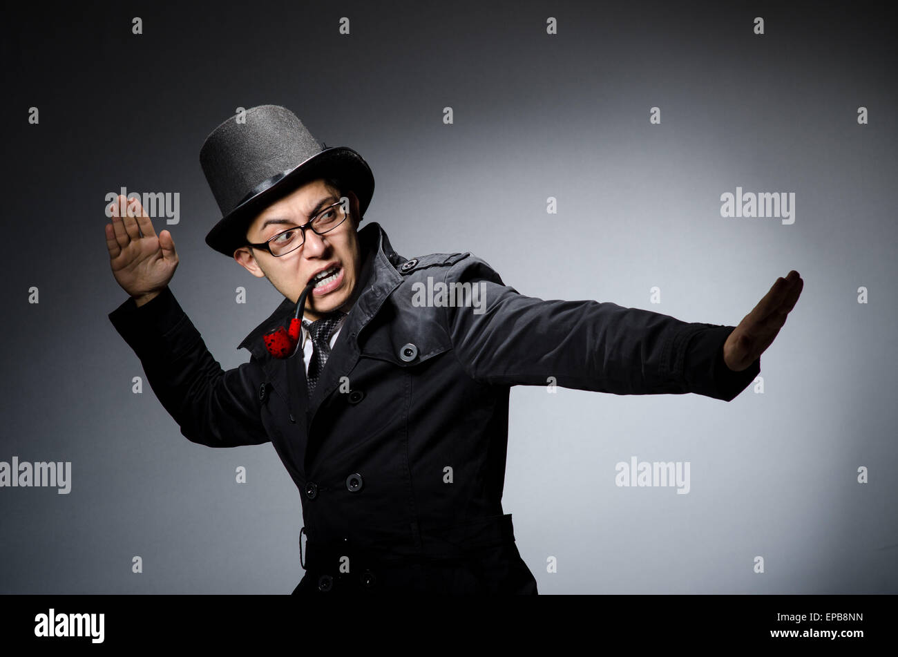 Funny detective with pipe and hat Stock Photo - Alamy