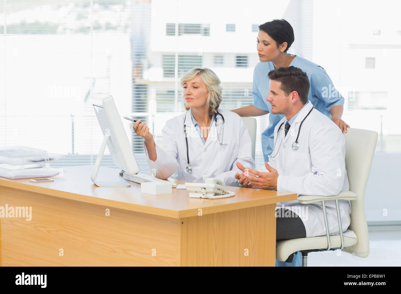 Doctor hands together desk hi-res stock photography and images - Alamy