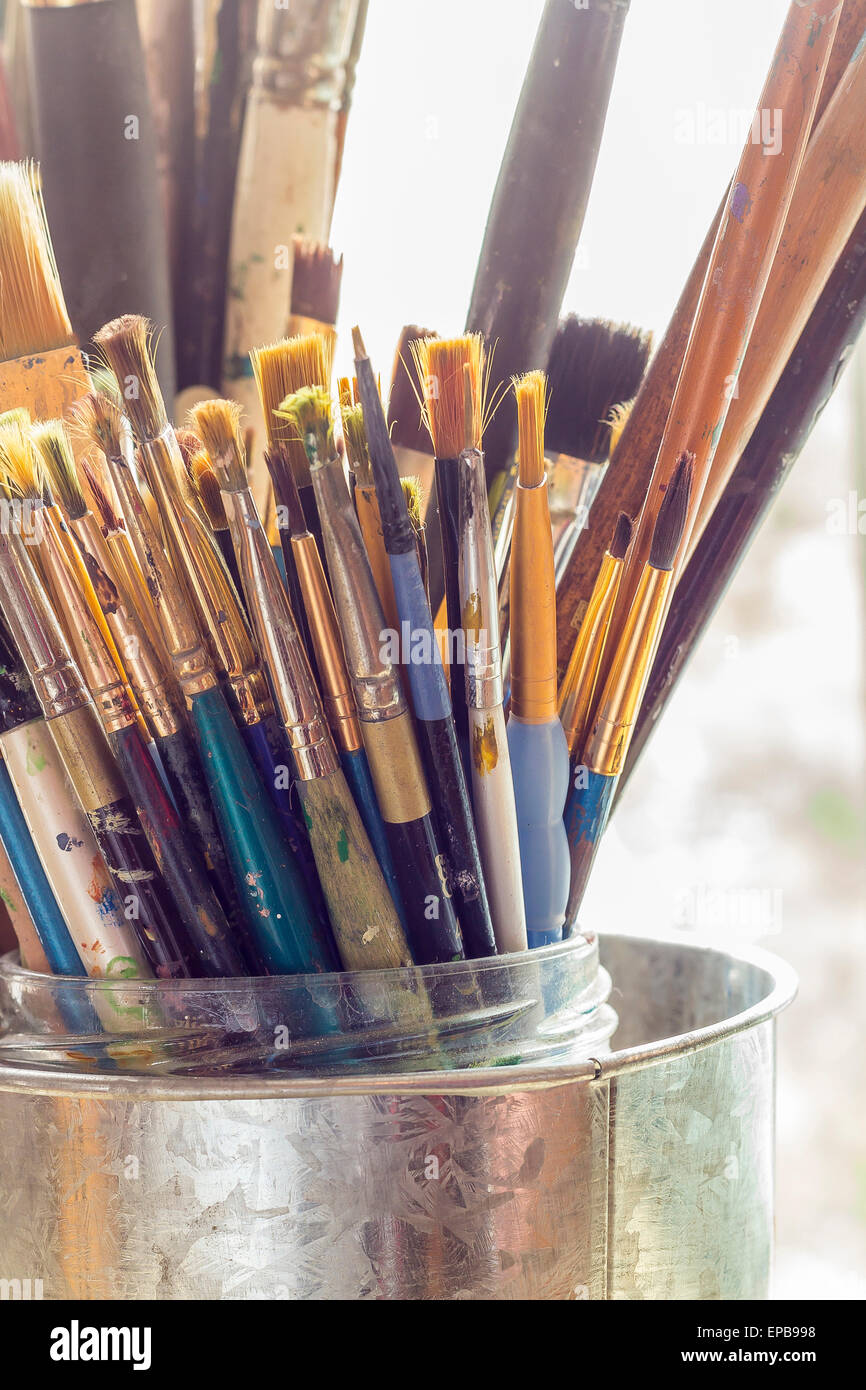Container kit of assorted and stained old artist paintbrushes Stock ...