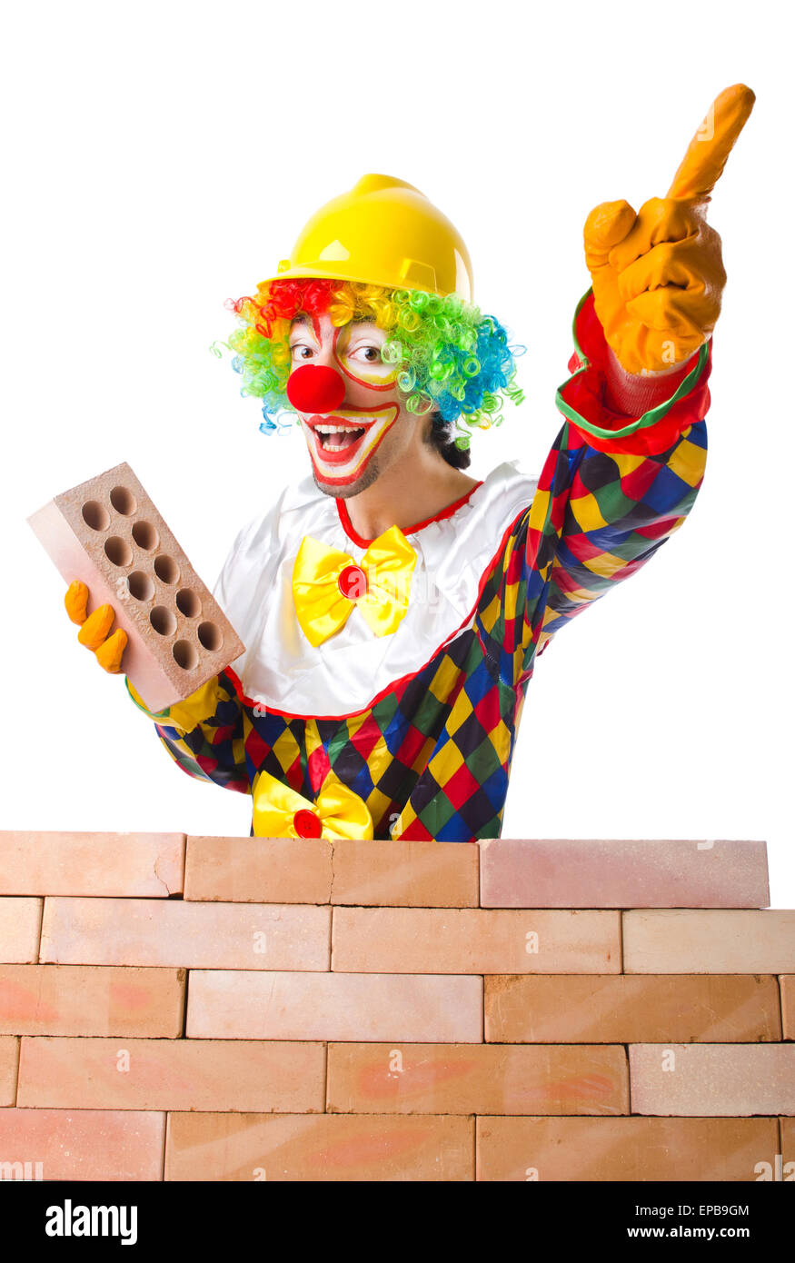 Bad construction concept with clown laying bricks Stock Photo - Alamy