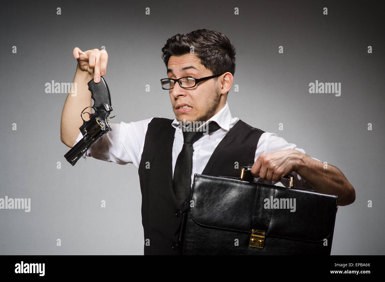 Man with gun and briefcase Stock Photo - Alamy