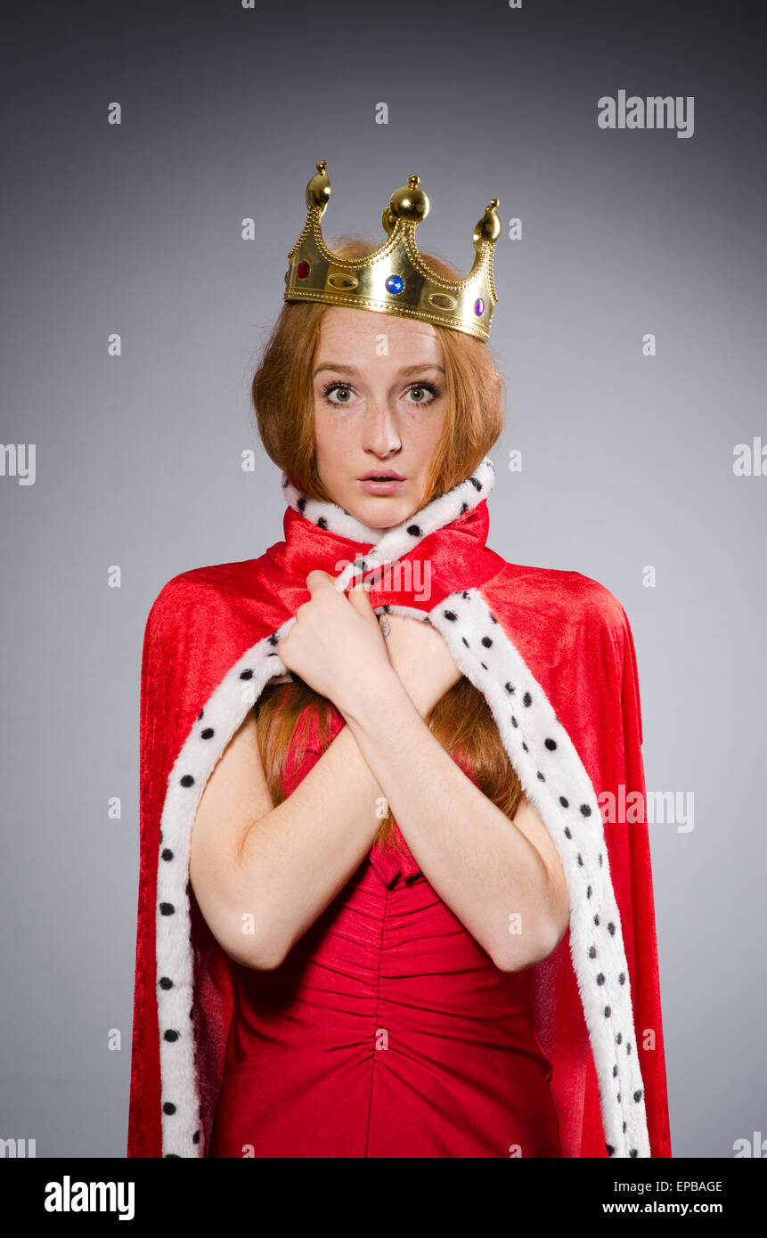 Queen in red dress in studio Stock Photo - Alamy