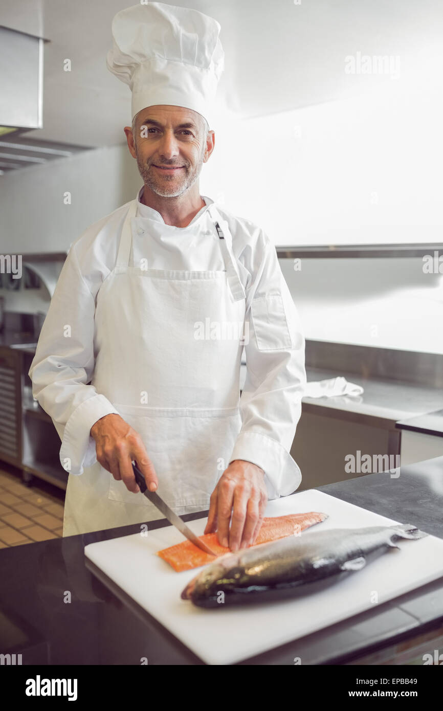 Male chef cutting fish hi-res stock photography and images - Alamy