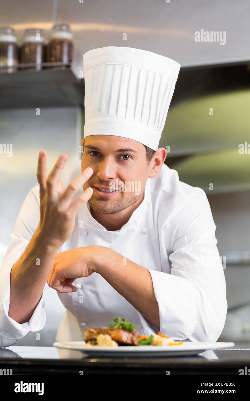 Smiling male chef with cooked food in kitchen Stock Photo - Alamy