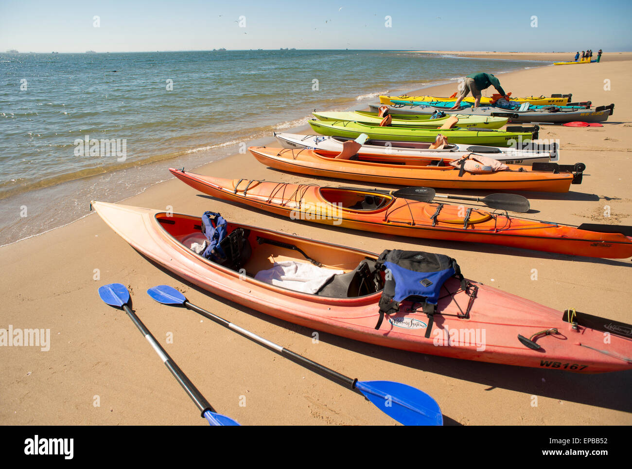 Walvis Bay. Kayaks lined along beach Stock Photo - Alamy