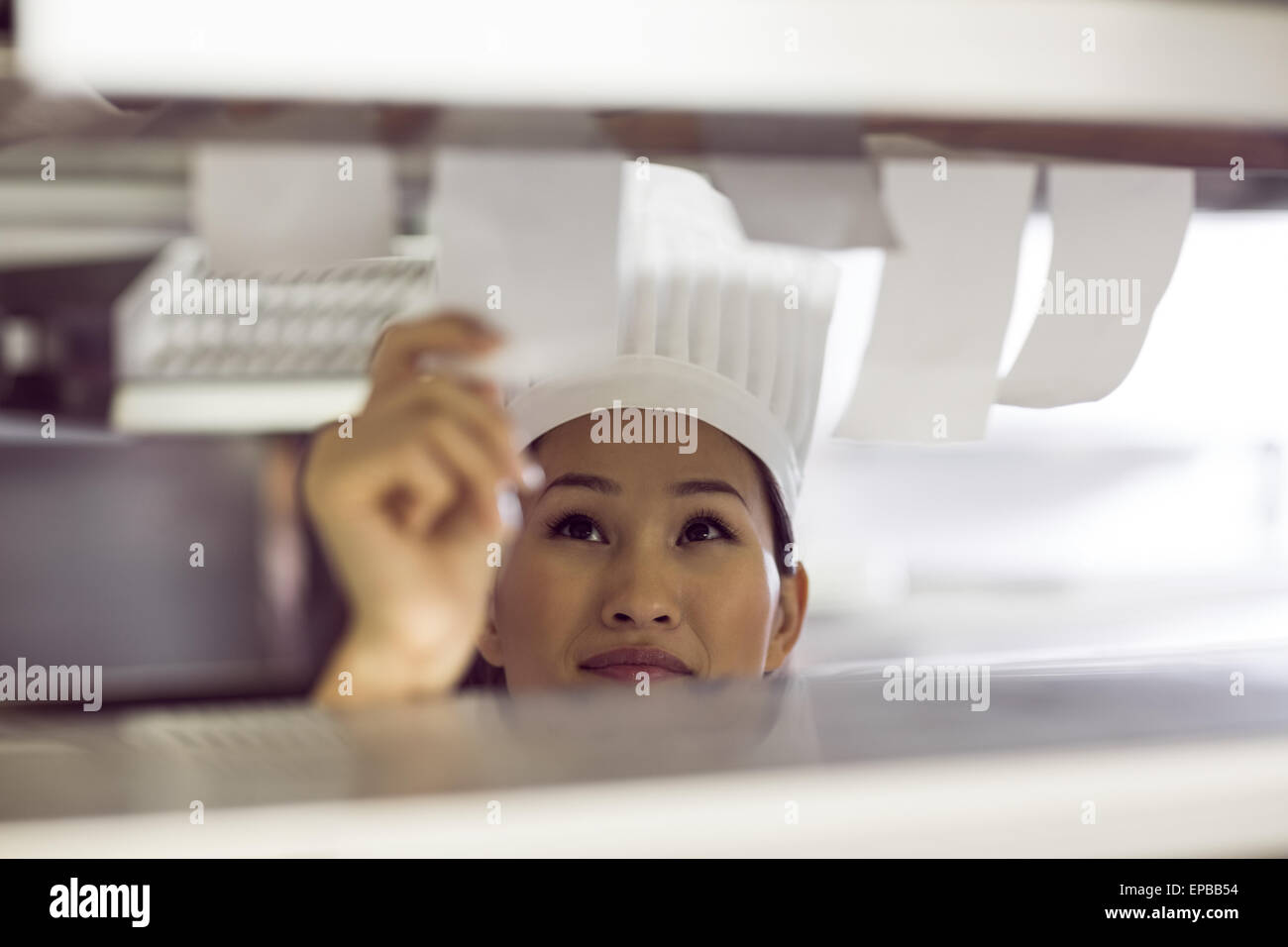 Female chef going through cooking checklist at kitchen Stock Photo - Alamy