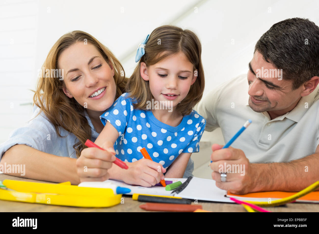 Family coloring together Stock Photo - Alamy