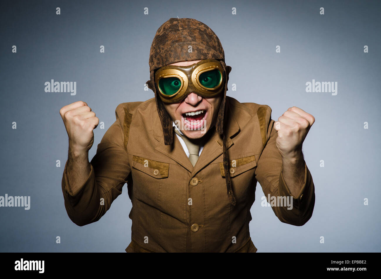 Funny pilot with goggles and helmet Stock Photo - Alamy