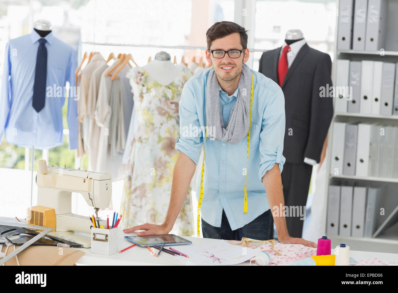 Portrait of a smiling handsome male fashion designer Stock Photo - Alamy