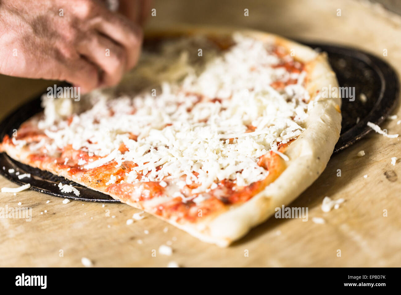 Fresh made pizza in Italian restaurant Stock Photo - Alamy
