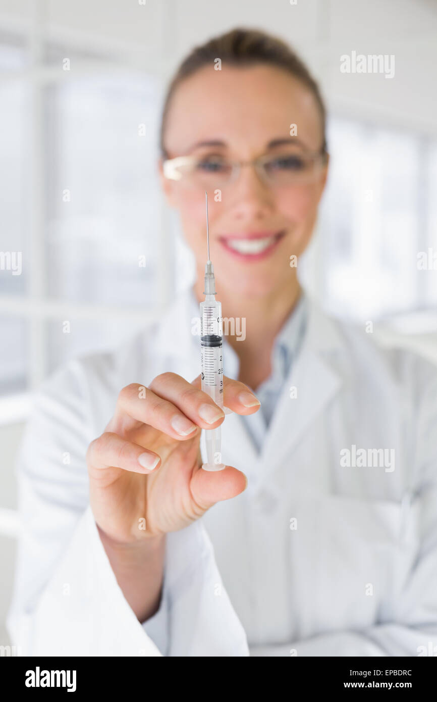 Female doctor holding an injection in hospital Stock Photo - Alamy