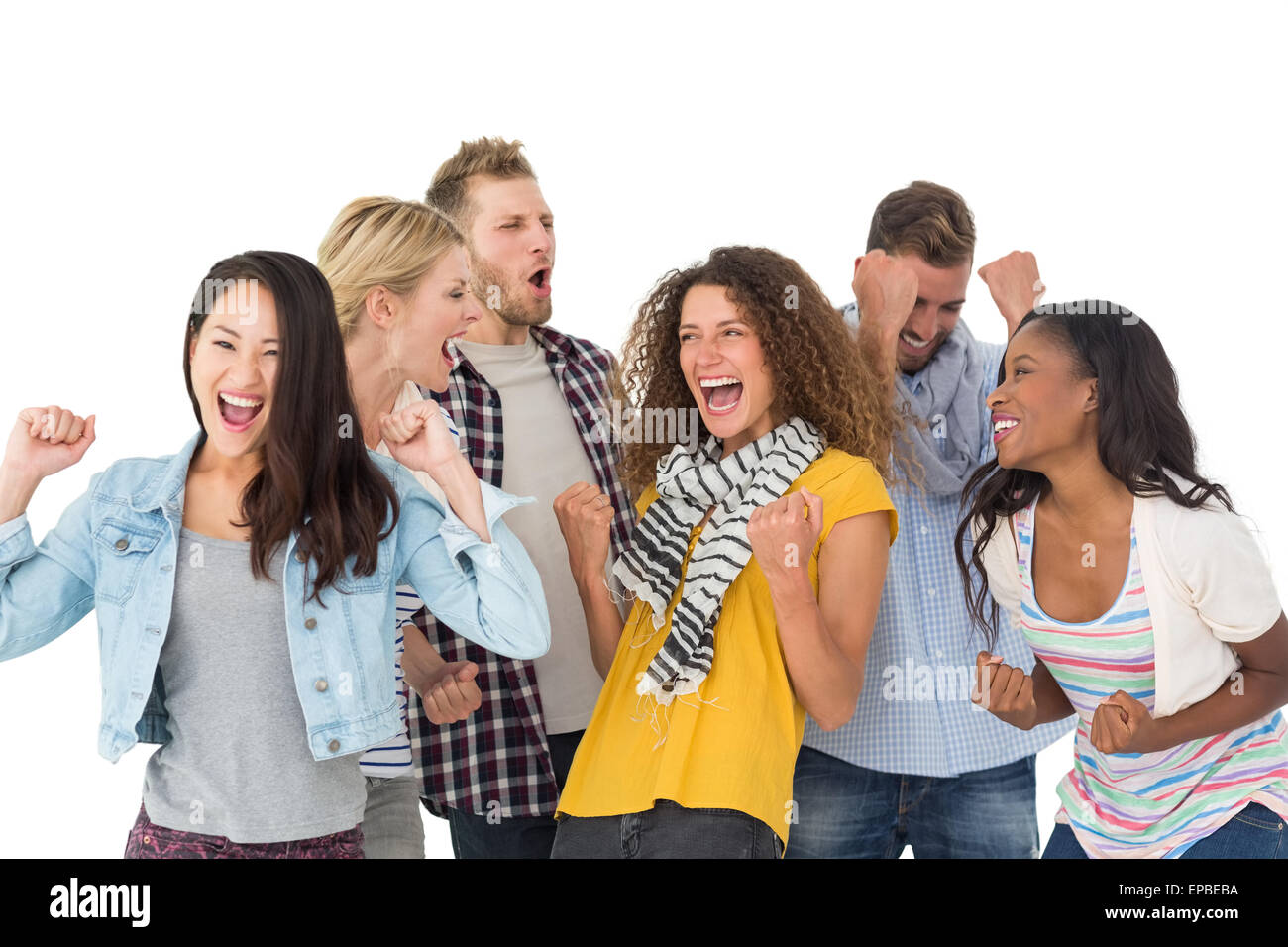 Happy group of young friends cheering Stock Photo - Alamy