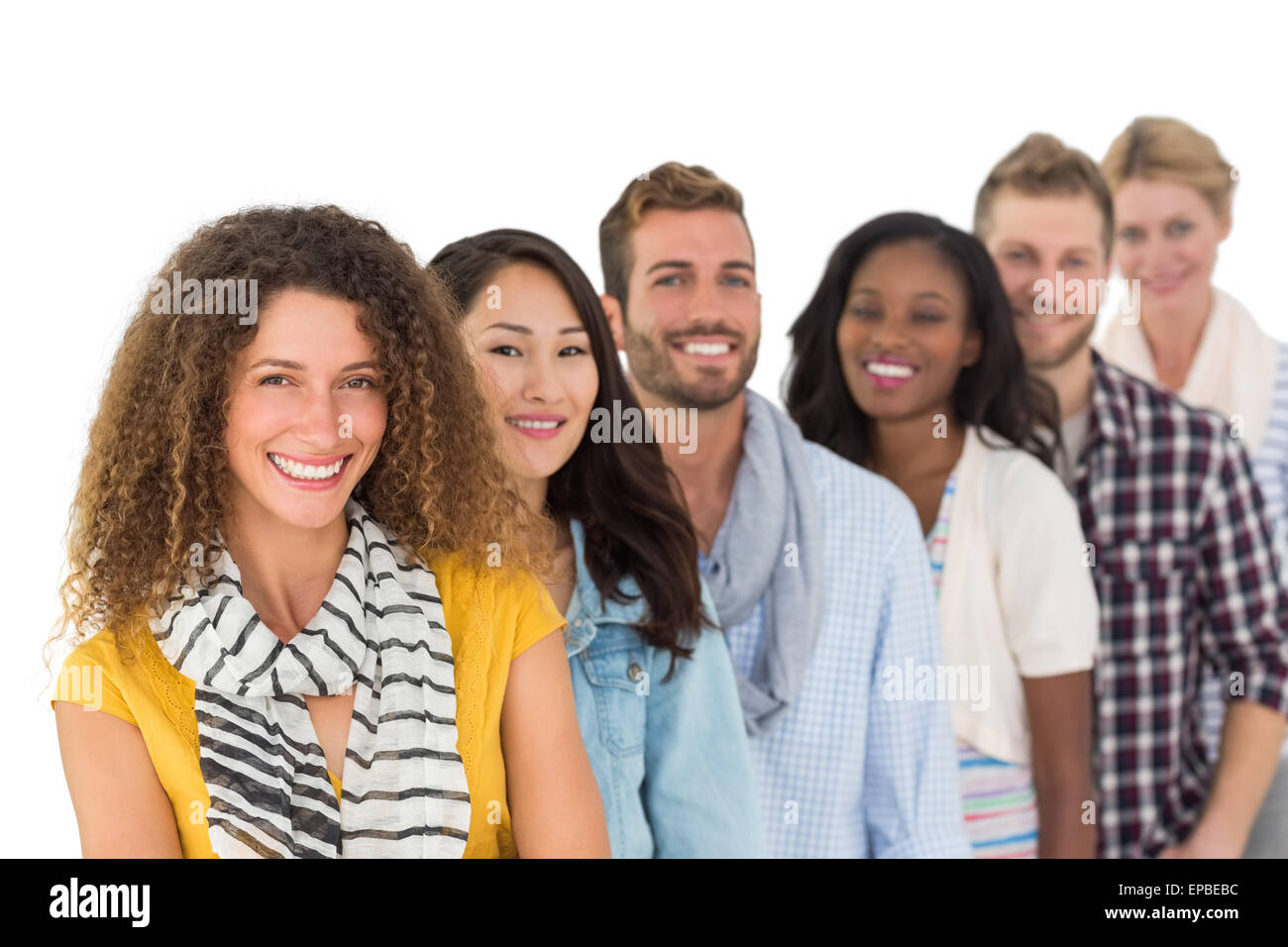 Happy group of young friends standing in a row Stock Photo - Alamy