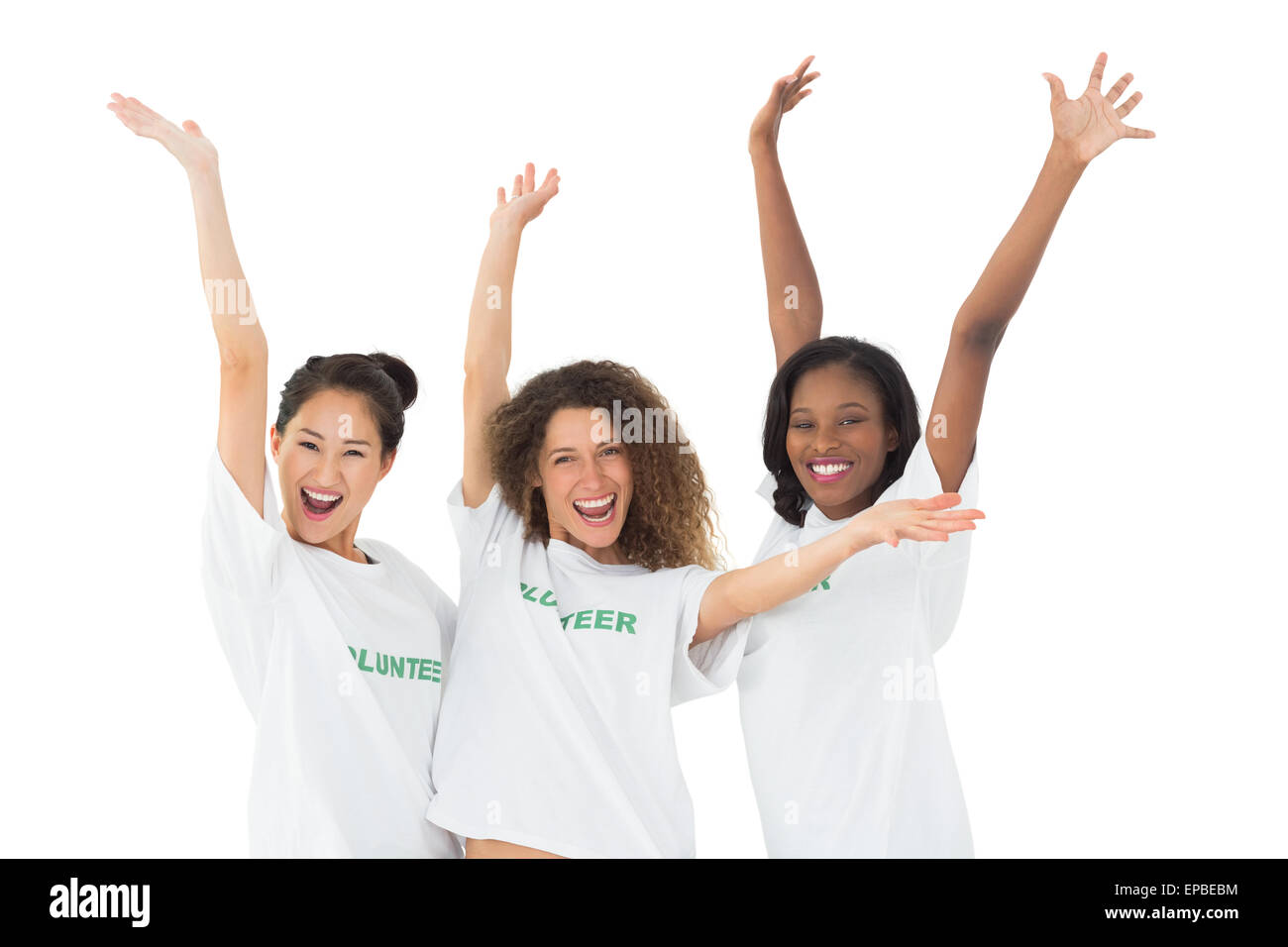 Attractive team of volunteers waving at camera Stock Photo - Alamy