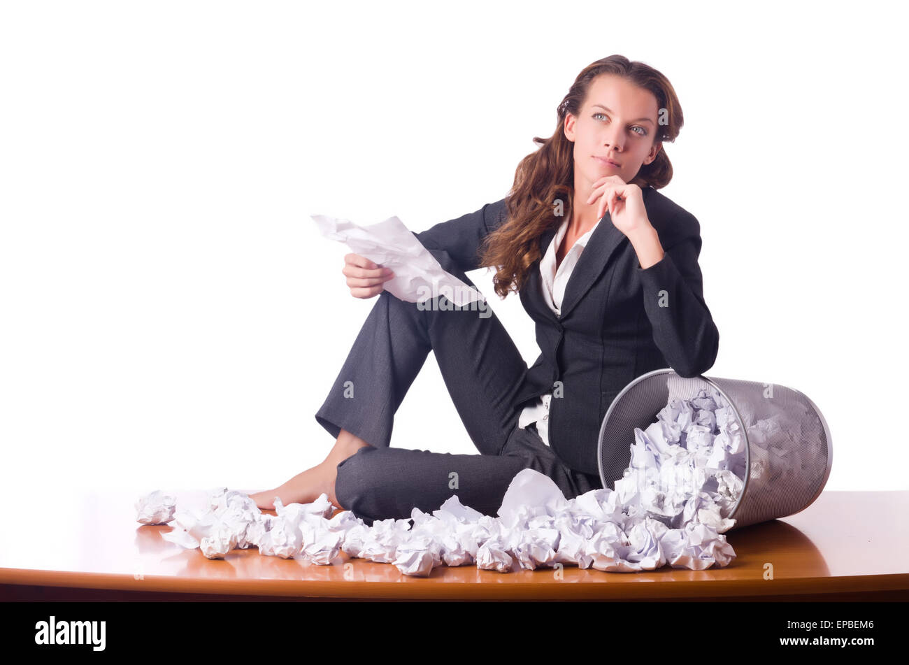 Woman with lots of discarded paper Stock Photo - Alamy