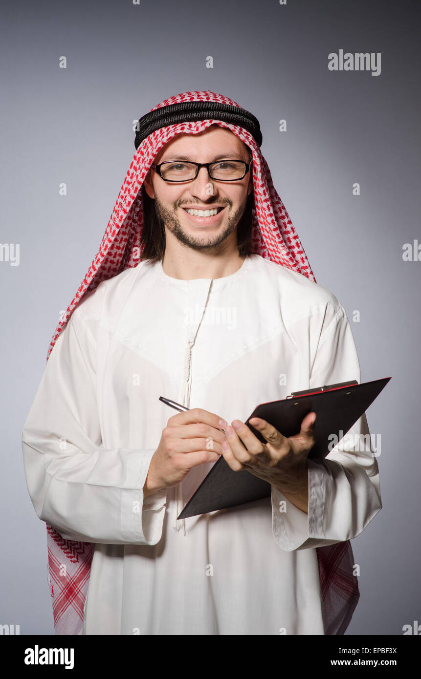 Arab man with paper binder Stock Photo - Alamy