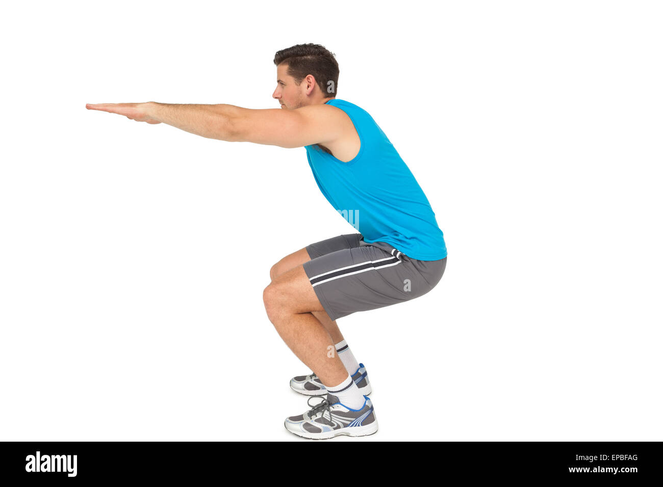 Side view of a fit young man doing stretching exercise Stock Photo - Alamy