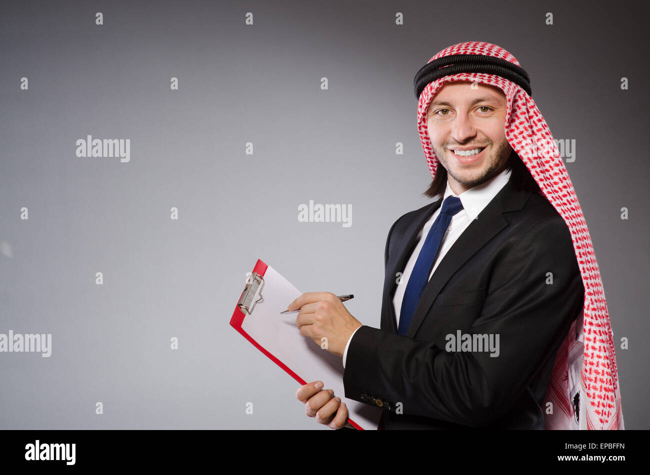 Arab man with paper binder Stock Photo - Alamy