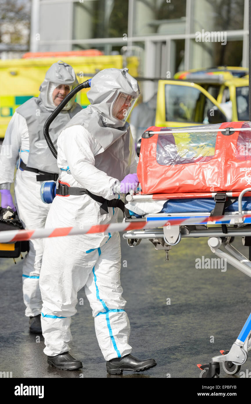 Biohazard medical team with stretcher Stock Photo - Alamy