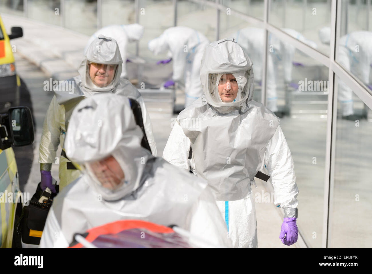 Biohazard medical team in protective uniform Stock Photo - Alamy