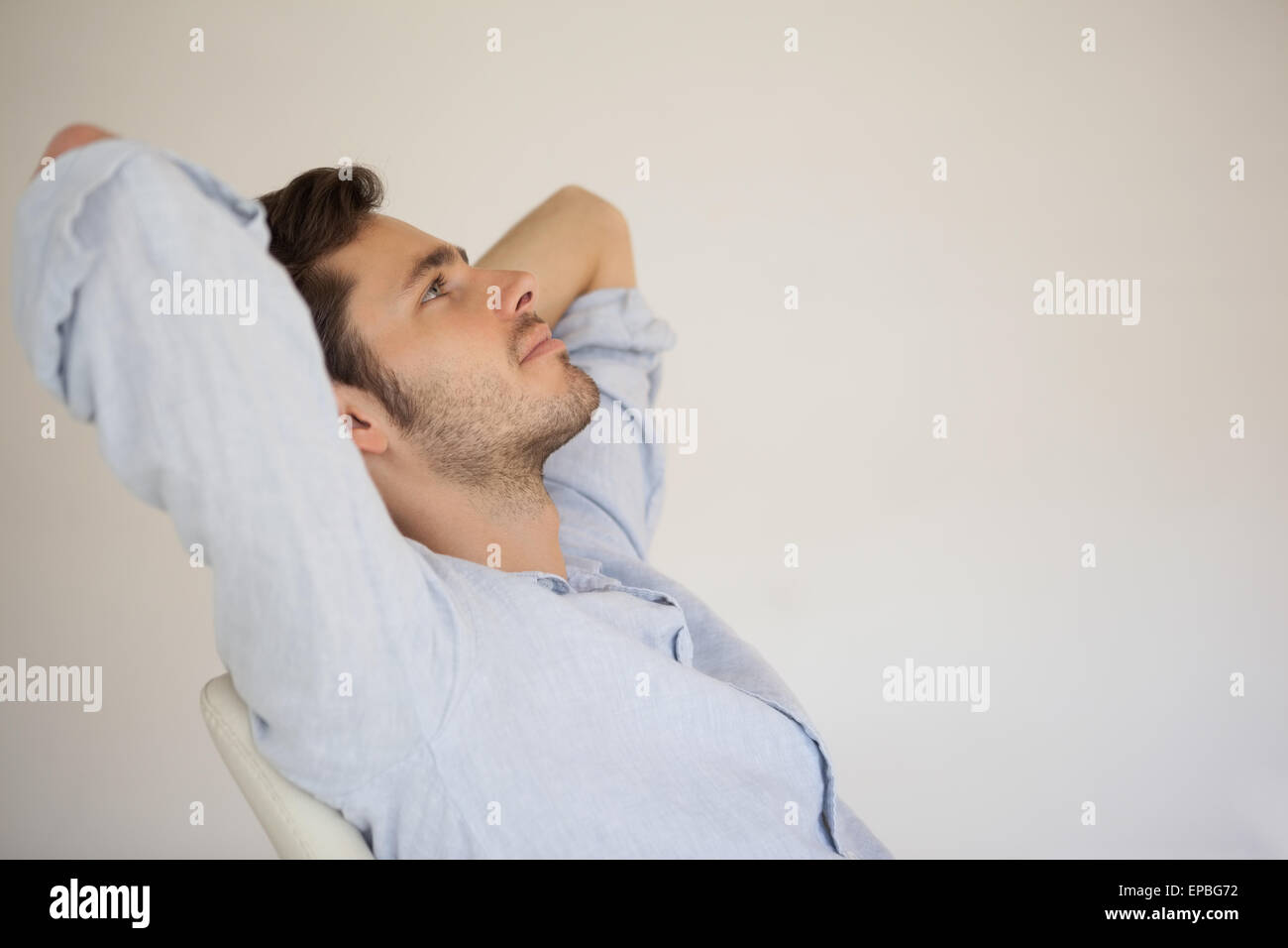 Man desk leaning back hands hi-res stock photography and images - Alamy