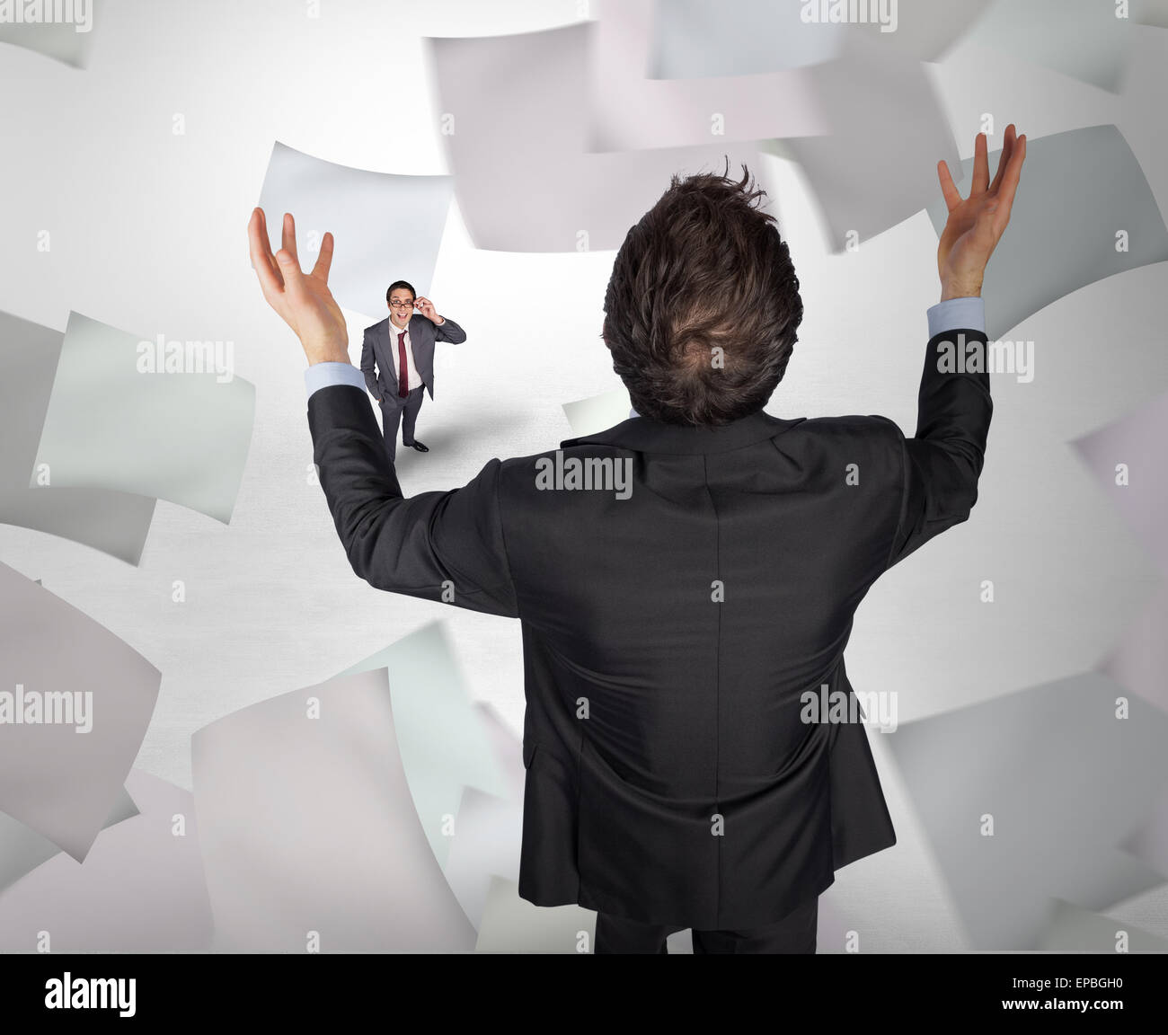 Composite image of gesturing businessman with tiny businessman Stock ...