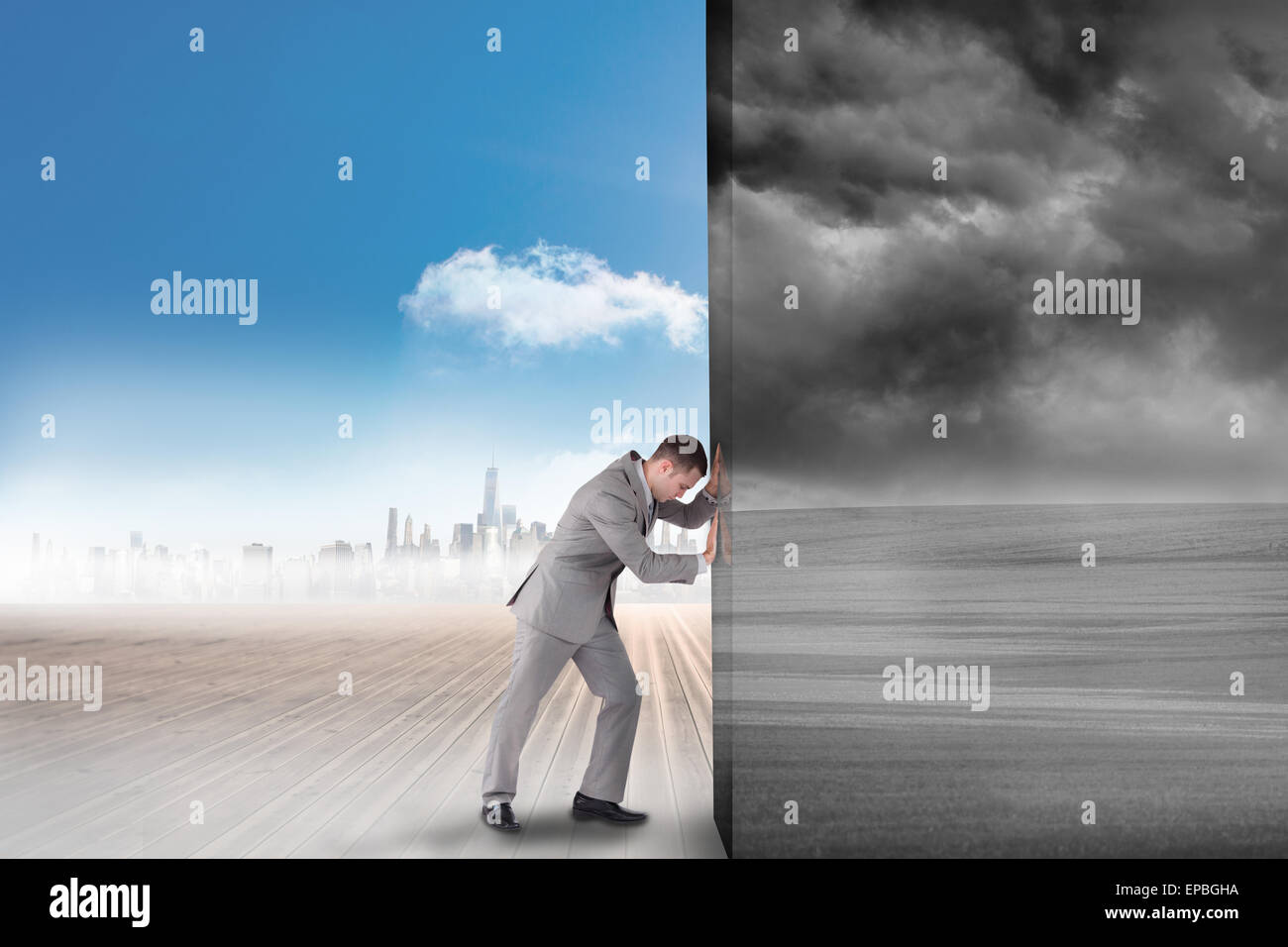 Composite image of businessman pushing away scene Stock Photo - Alamy