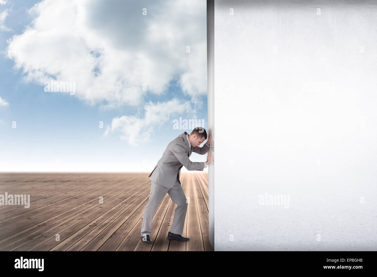 Composite image of businessman pushing away scene Stock Photo - Alamy
