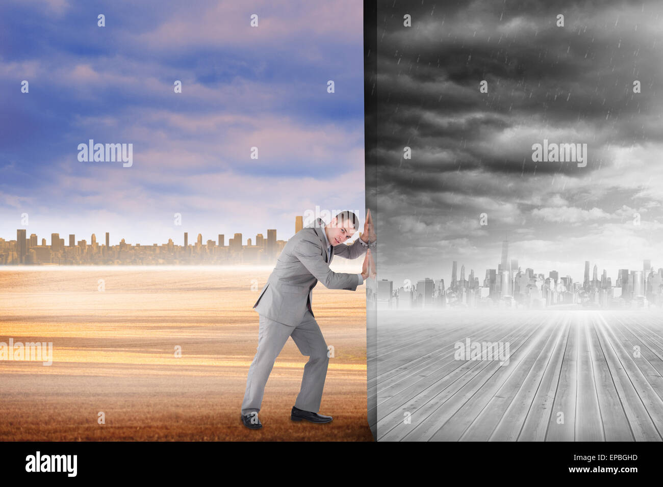 Composite image of businessman pushing away scene Stock Photo - Alamy