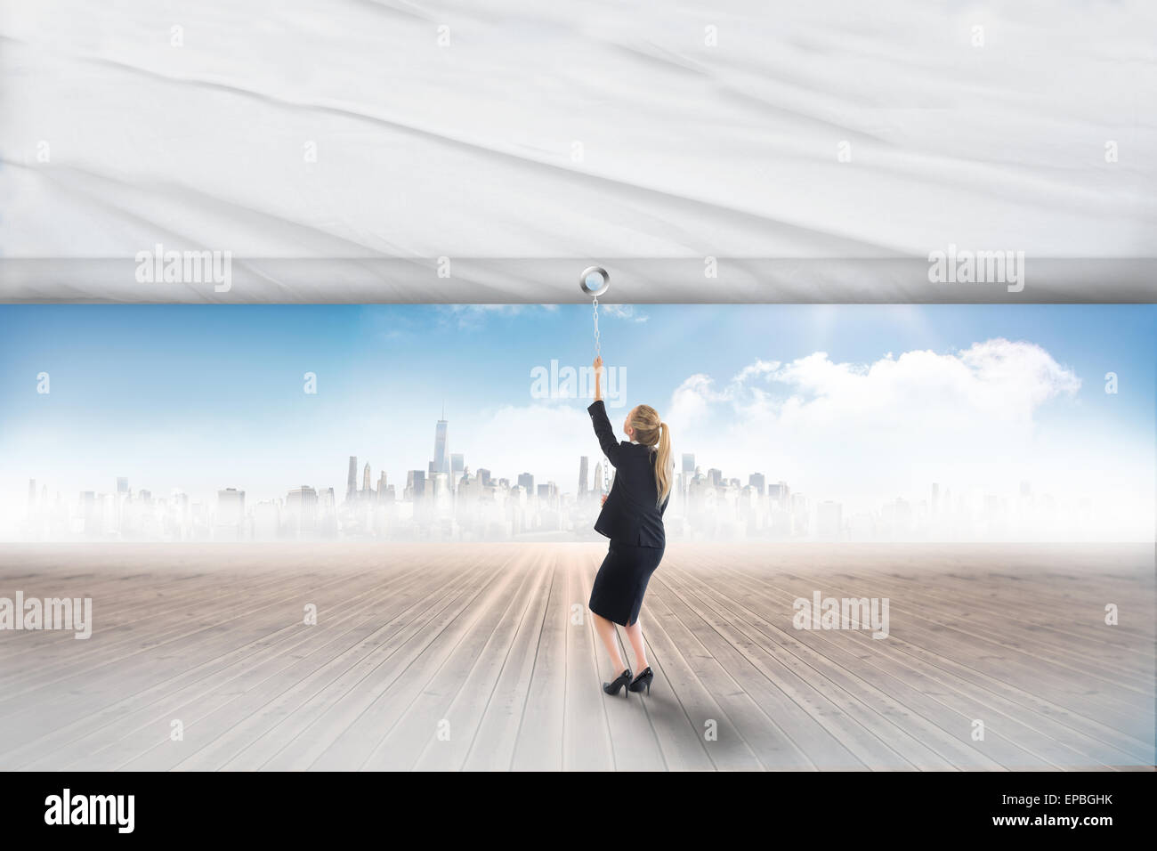 Composite image of businesswoman pulling a white screen Stock Photo - Alamy