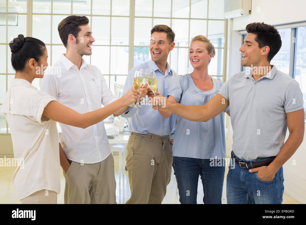 Casual business team celebrating champagne hi-res stock photography and ...