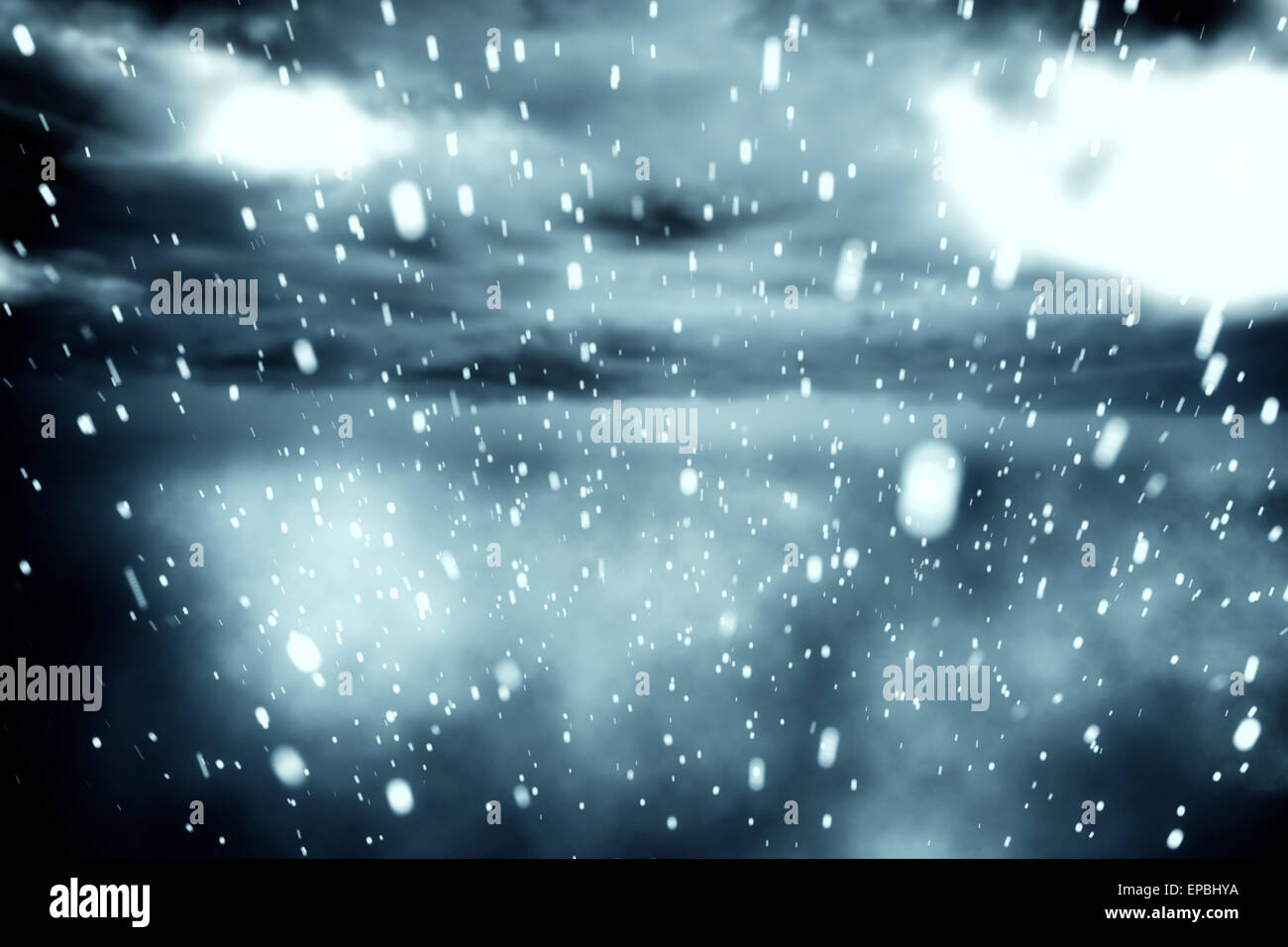 Cloudy sky with snow falling Stock Photo - Alamy