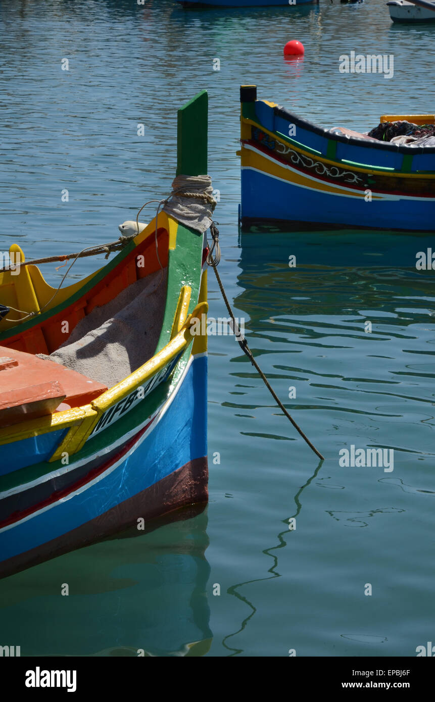 Traditional Maltese luzzu in Marsaxlokk harbour Stock Photo - Alamy