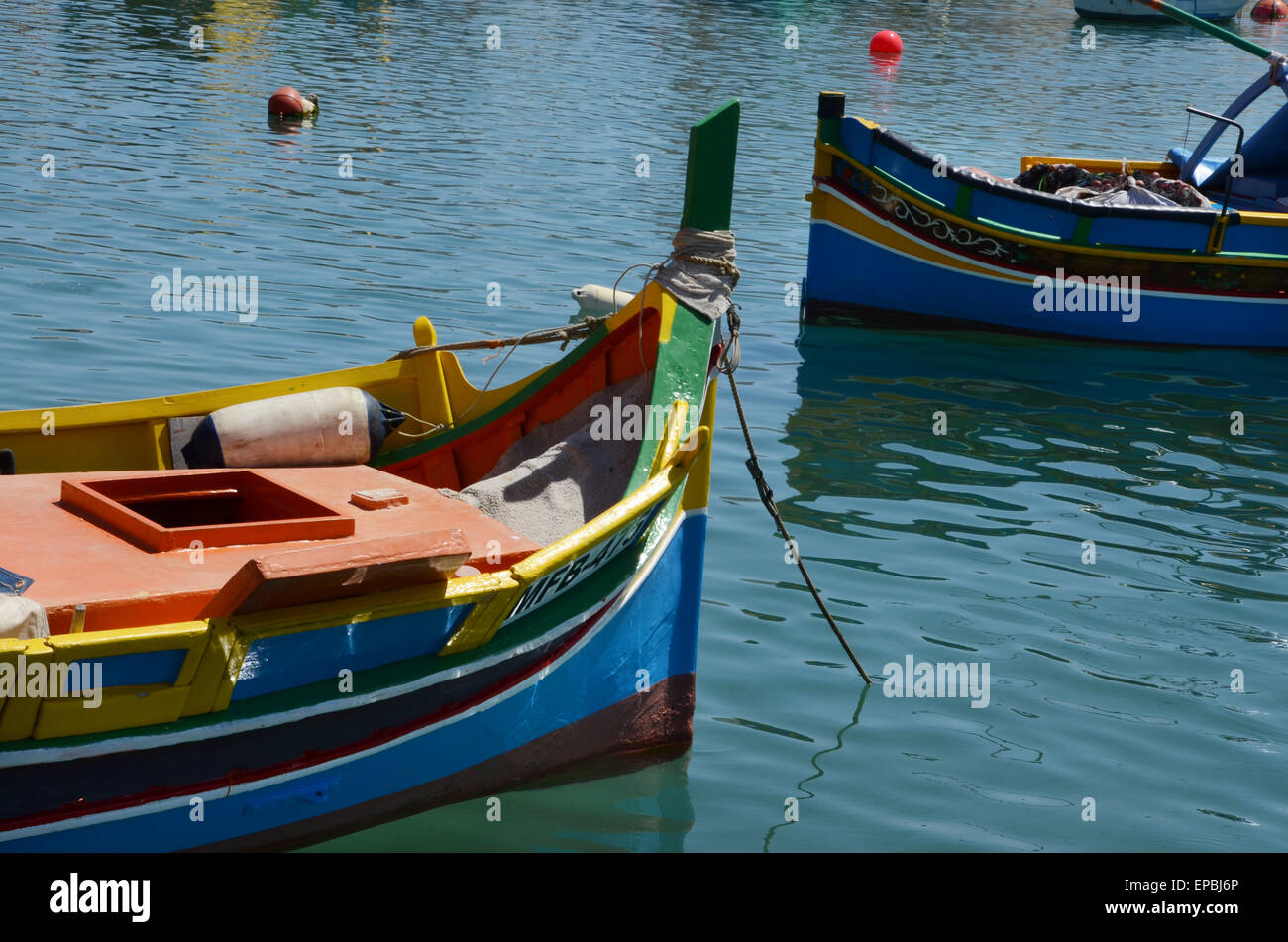 Traditional Maltese luzzu in Marsaxlokk harbour Stock Photo - Alamy