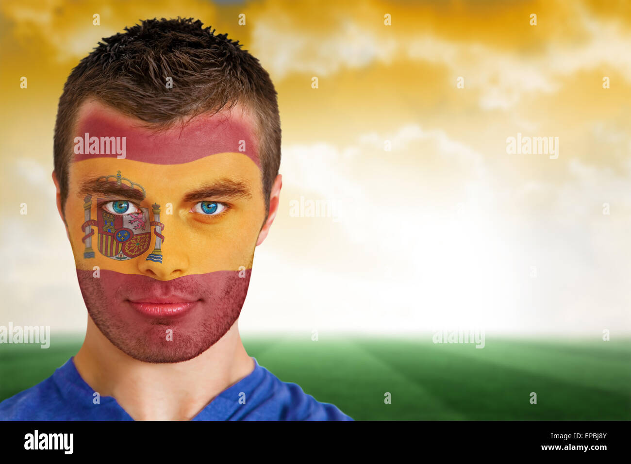 Spain football fan in face paint Stock Photo - Alamy
