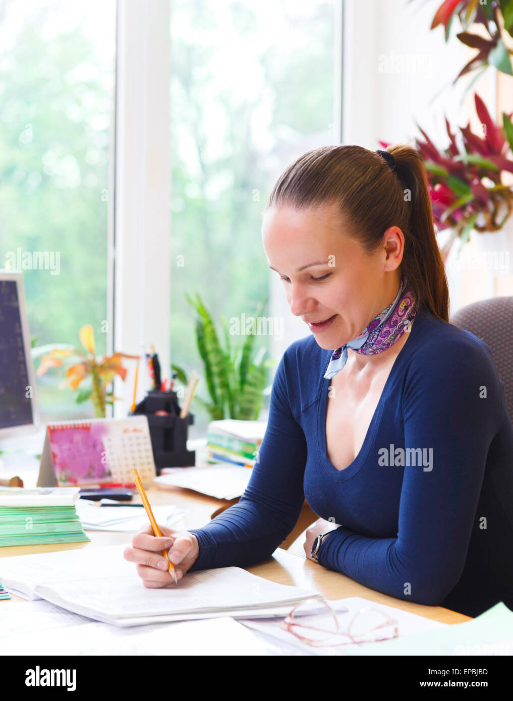 Portrait of teacher woman working in classroom Stock Photo - Alamy