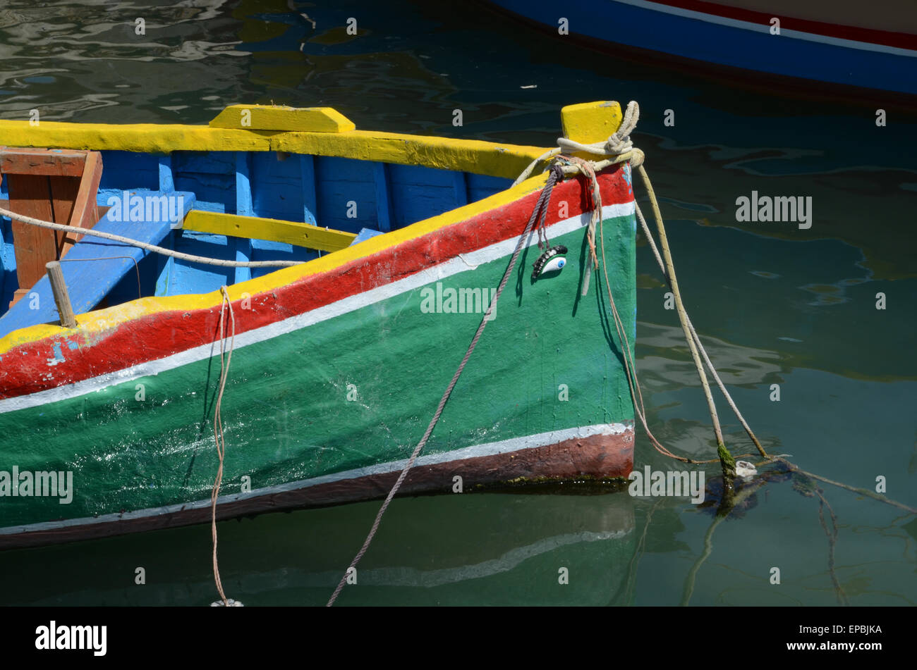 Traditional Maltese luzzu in Marsaxlokk harbour Stock Photo - Alamy