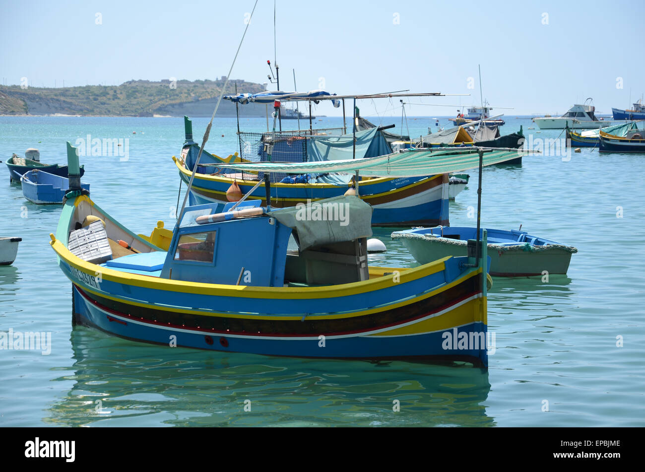 Traditional Maltese luzzu in Marsaxlokk harbour Stock Photo - Alamy